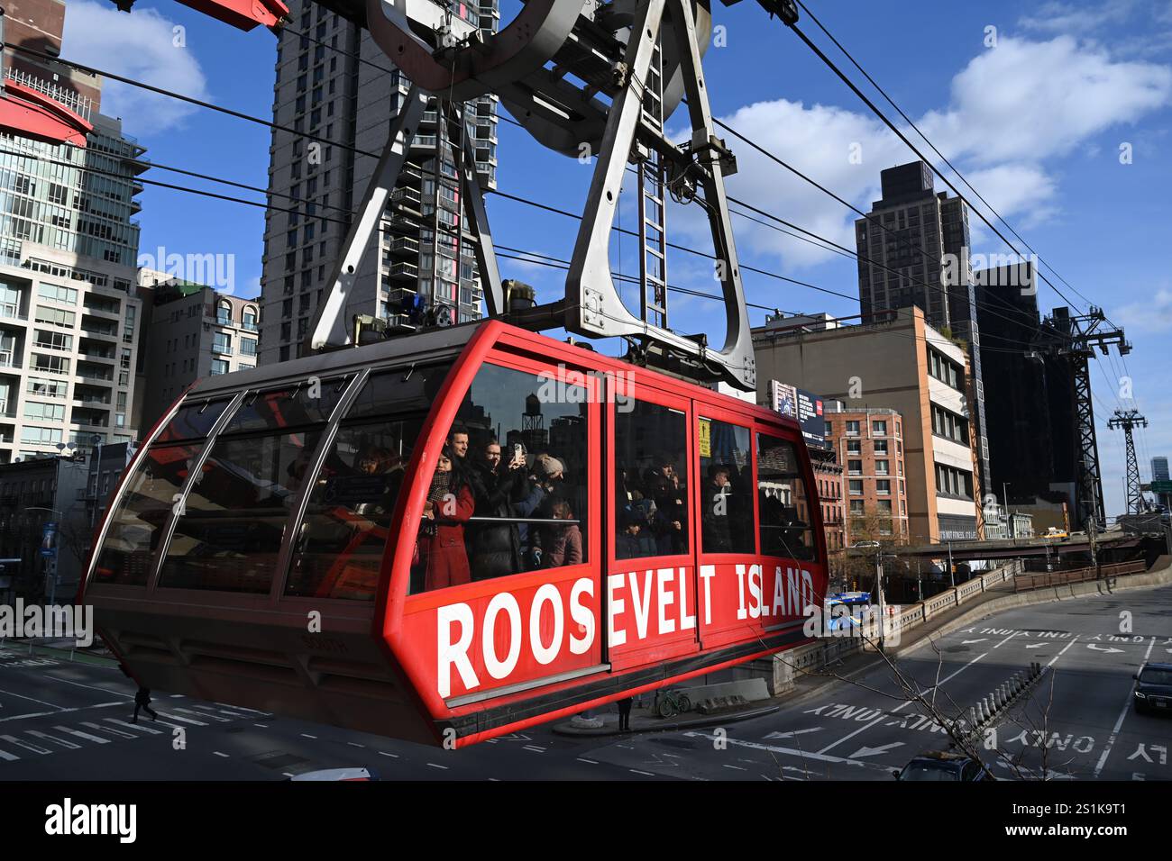 People ride the Roosevelt Island Tramway on January 3, 2025 in New York ...