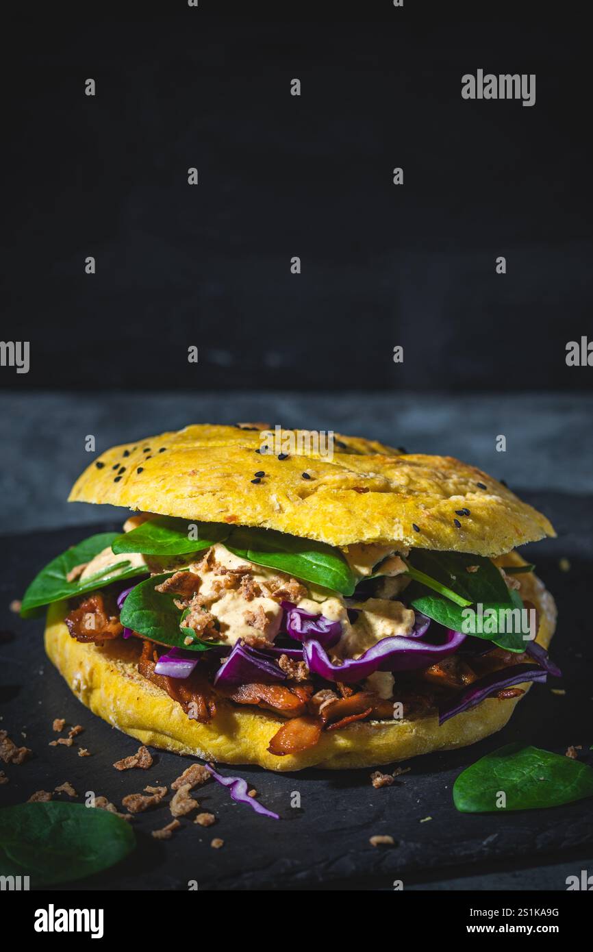 Homemade vegan doner burger in pumpkin flatbread filled with soy meat ...