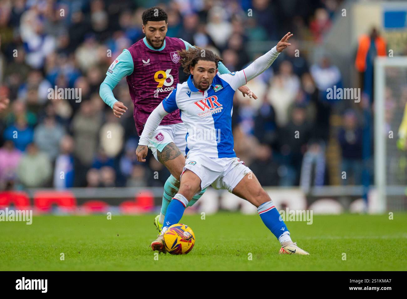 Tyrhys Dolan #10 of Blackburn Rovers challenged by the opponent during ...
