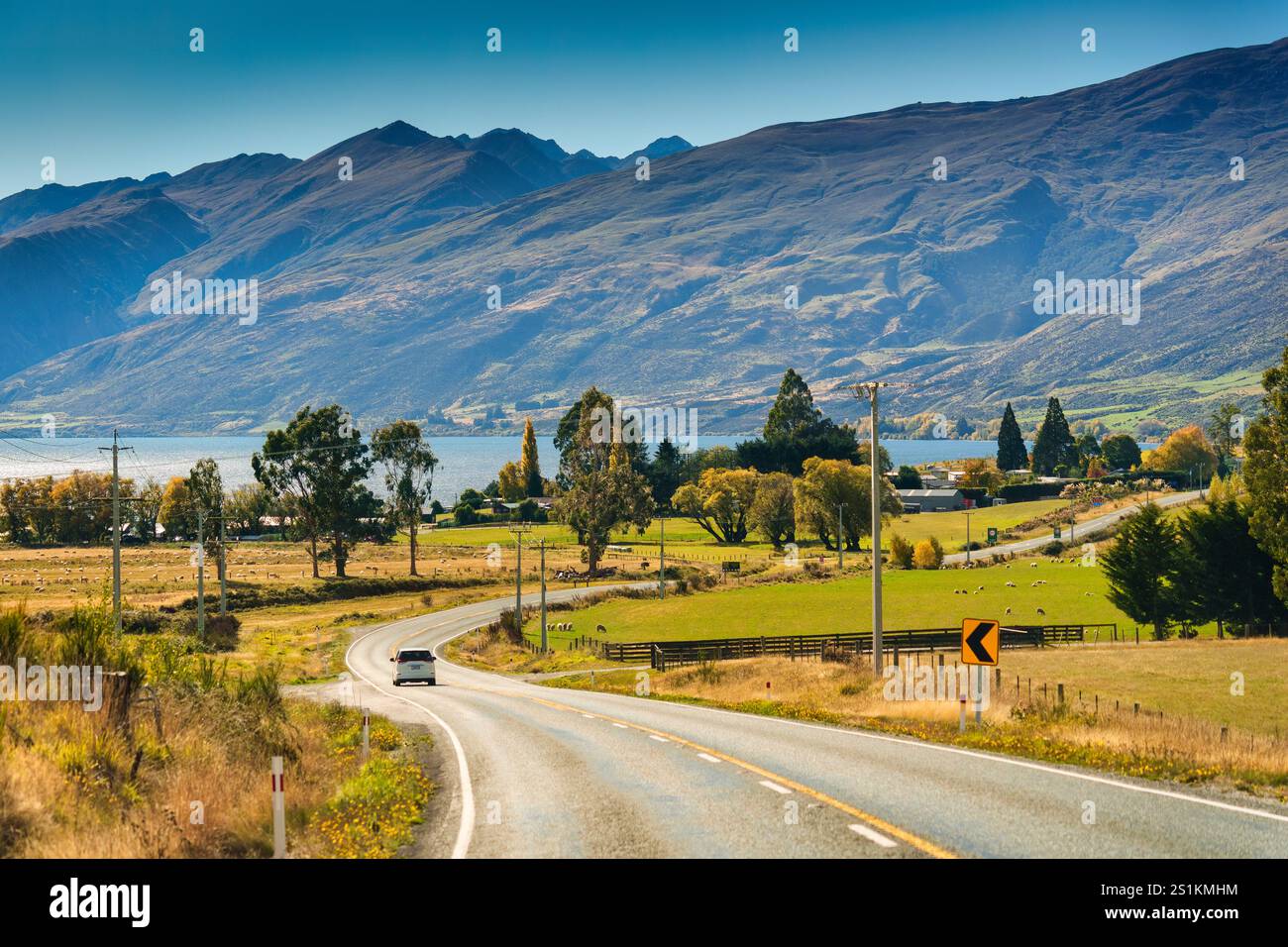 Scenic rural road trip with car driving on winding road with mountain ...