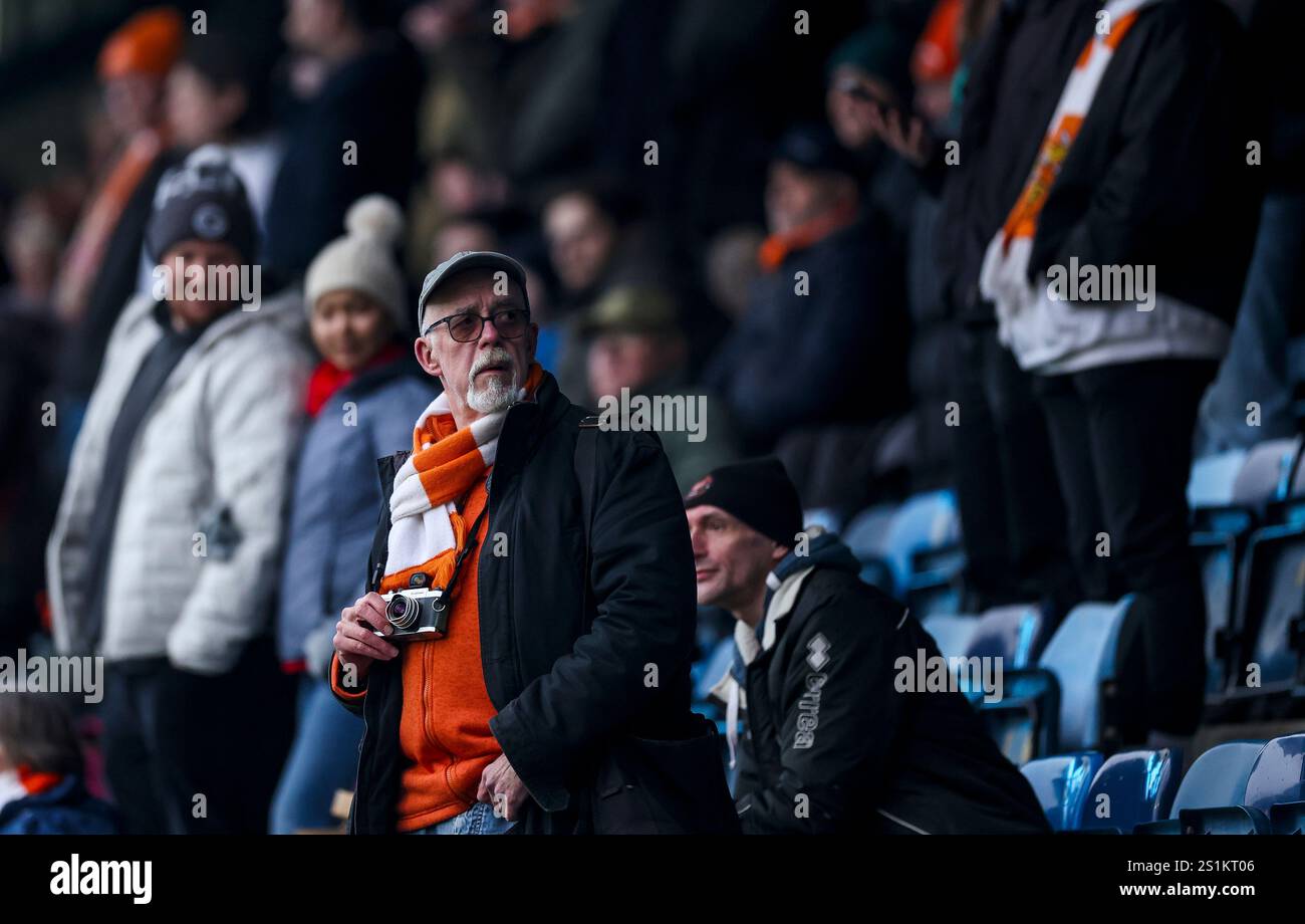 Blackpool fans watching the Sky Bet League One match at Adams Park ...