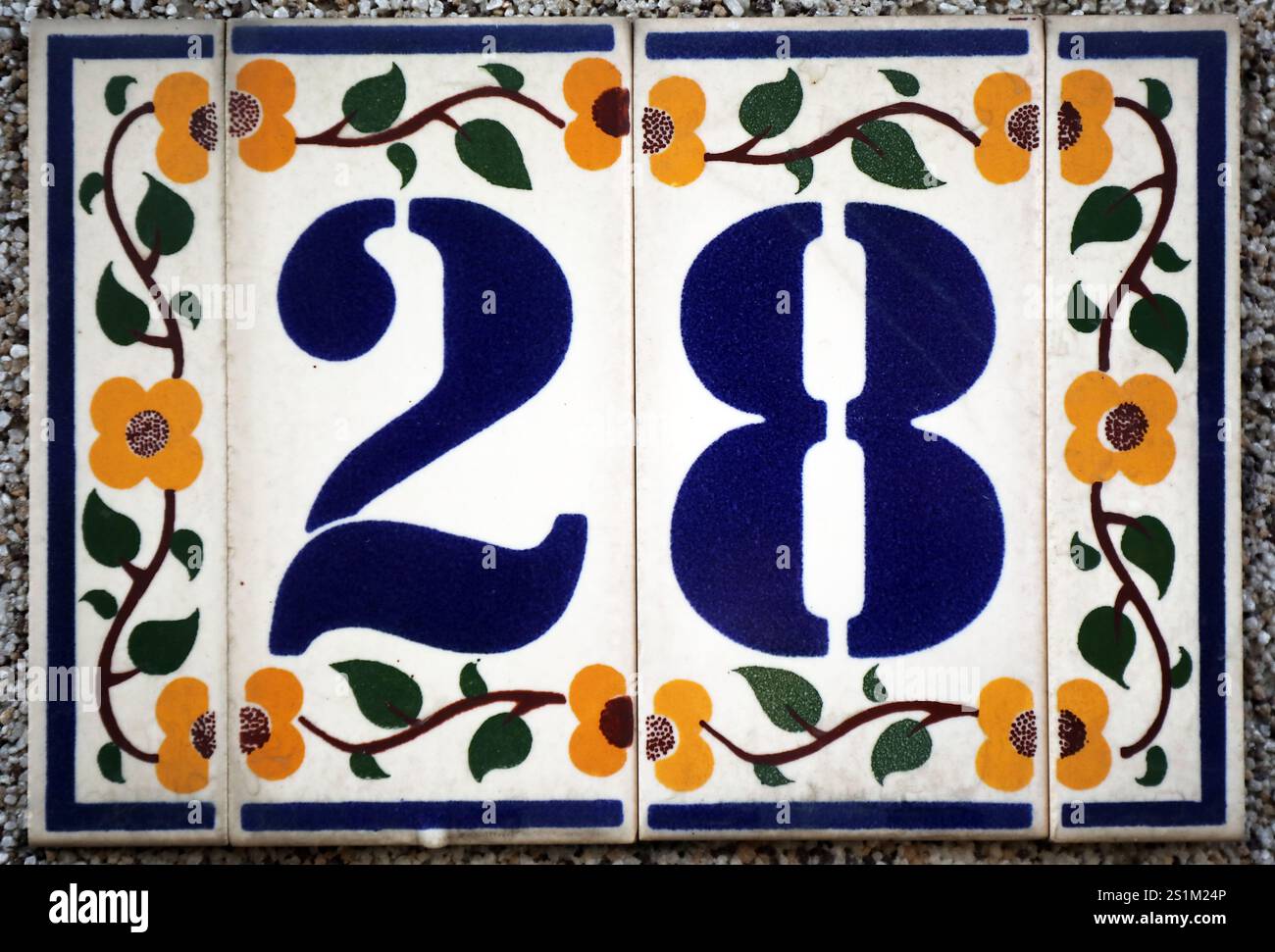 Ceramic tile with house number 28 on the wall background Stock Photo ...
