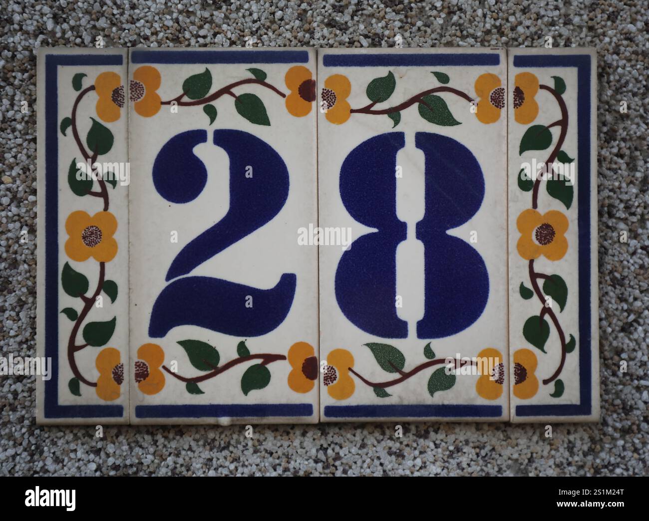 Ceramic tile with house number 28 on the wall background Stock Photo ...