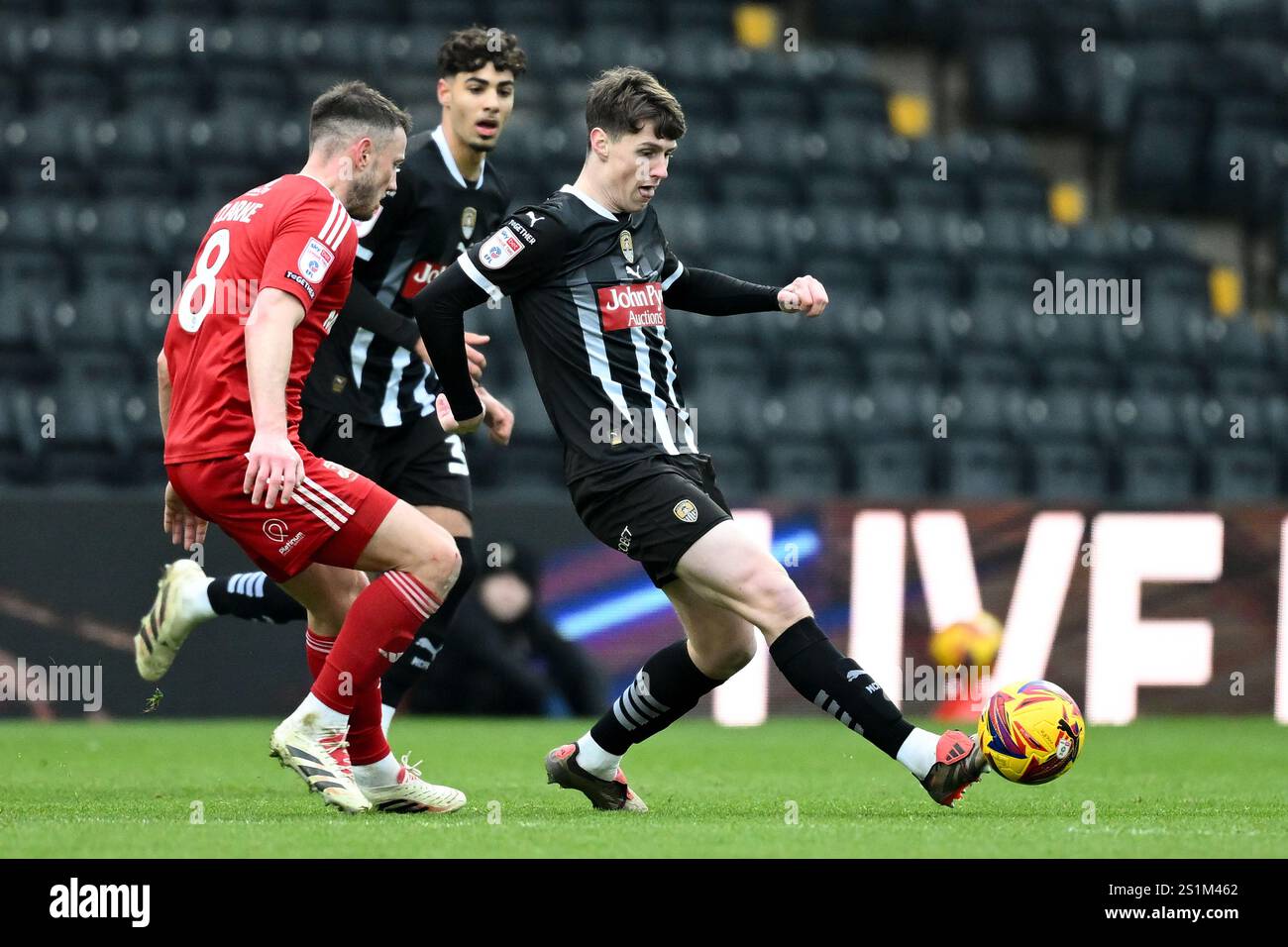 Jack Hinchy of Notts County under pressure from Ollie Clarke of Swindon Town during the Sky Bet ...