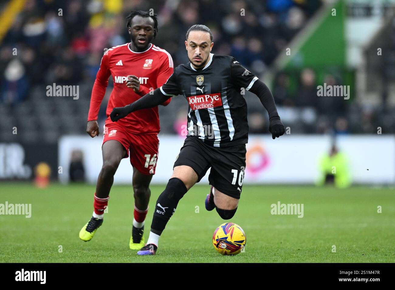 Jodi Jones of Notts County under pressure from Rosaire Longelo-Mbule of ...