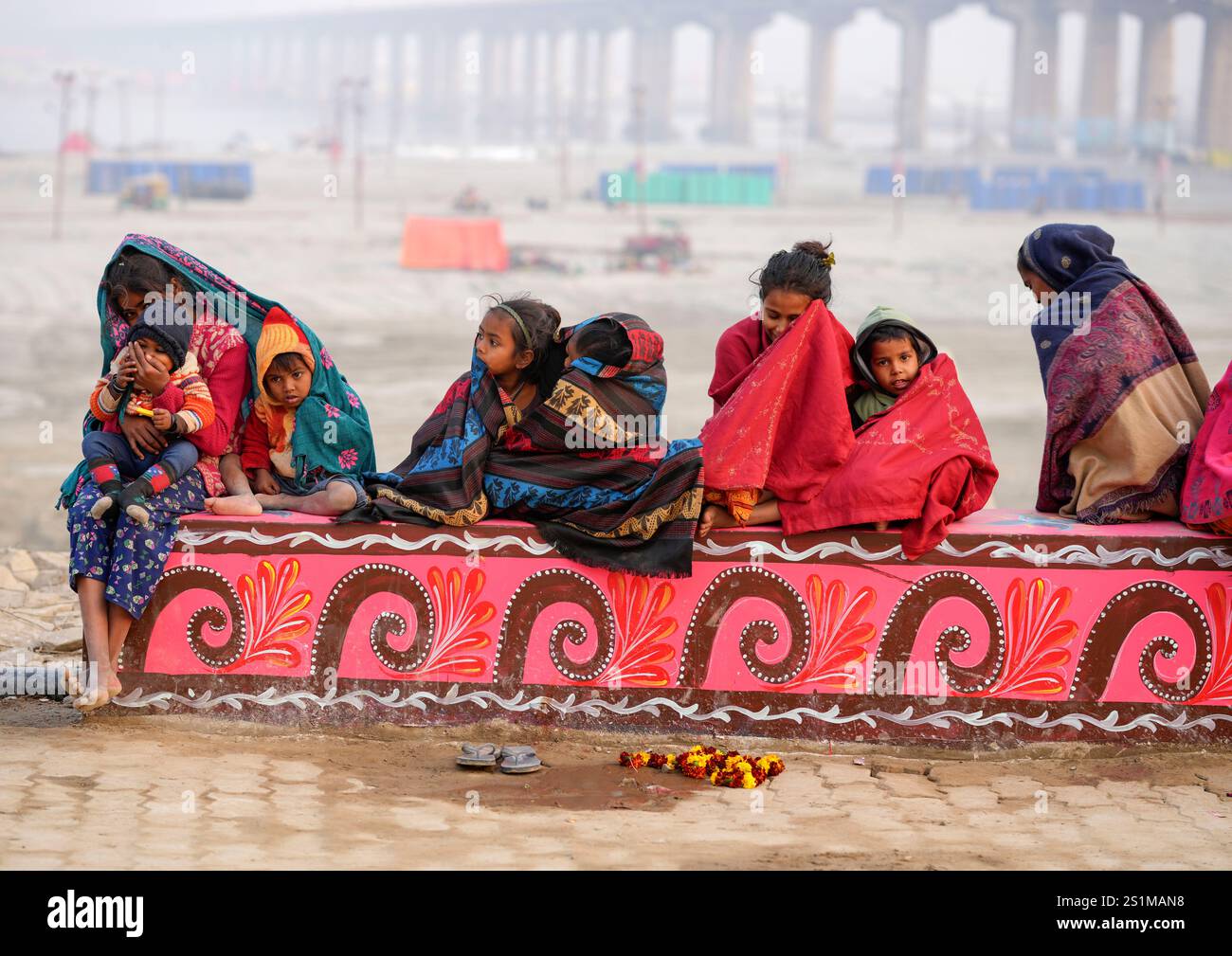 Indian children wrapped in blankets against the cold weather at Sangam ...
