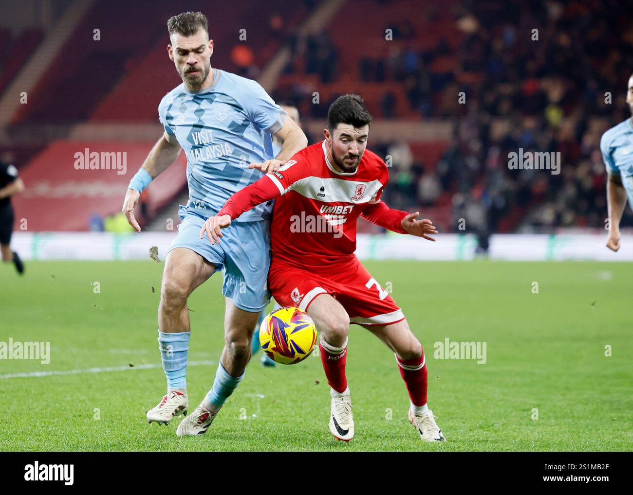 Cardiff City's Dimitris Goutas (left) and Middlesbrough's Finn Azaz (right) battle for the ball ...