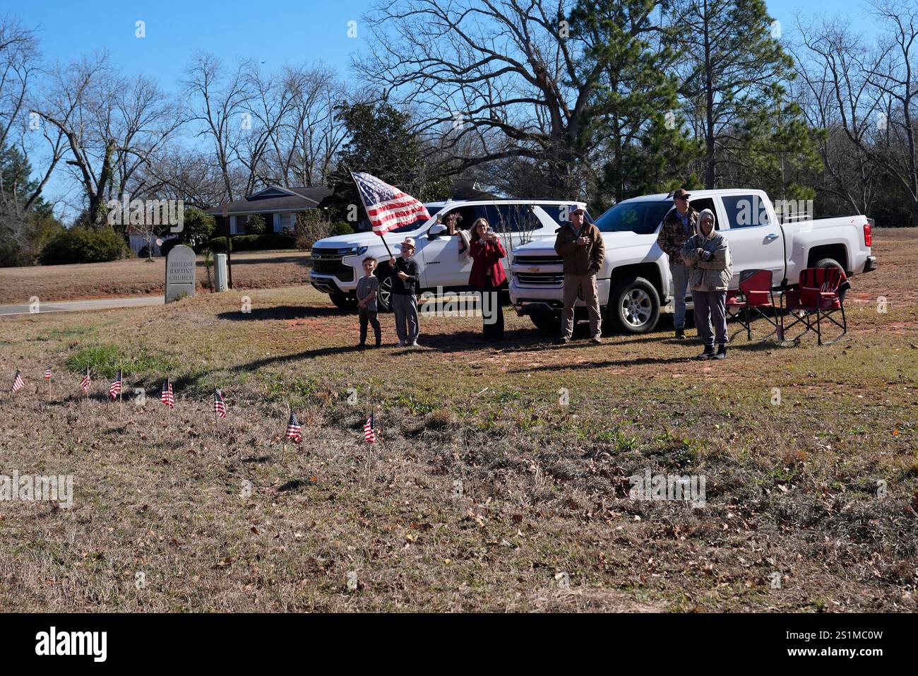 People watch as the hearse containing the casket of former President ...