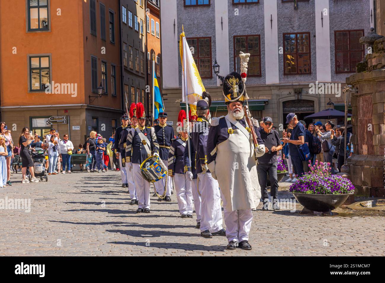 Parade with historical military uniforms and Swedish flags marching ...