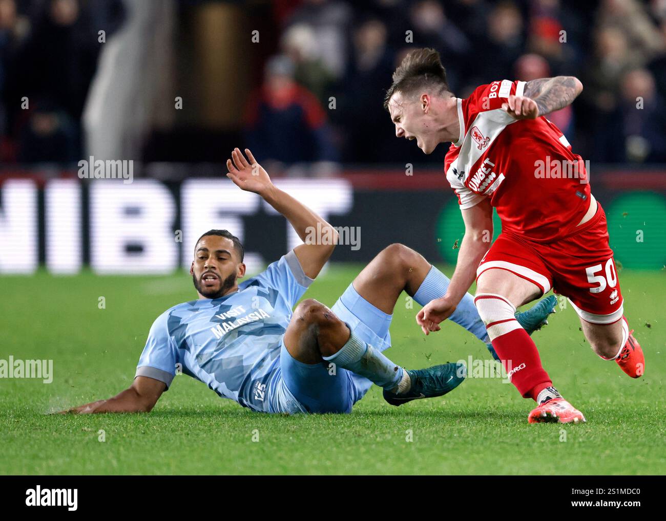 Cardiff City's Manolis Siopis (left) fouls Middlesbrough's Ben Doak ...