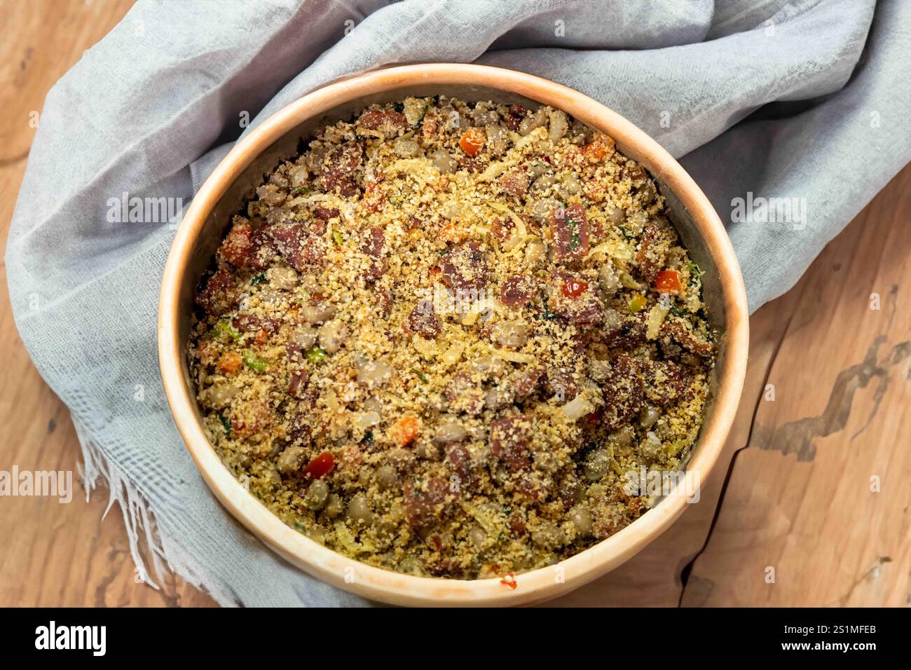 Traditional Brazilian farofa prepared with toasted cassava flour, bacon ...