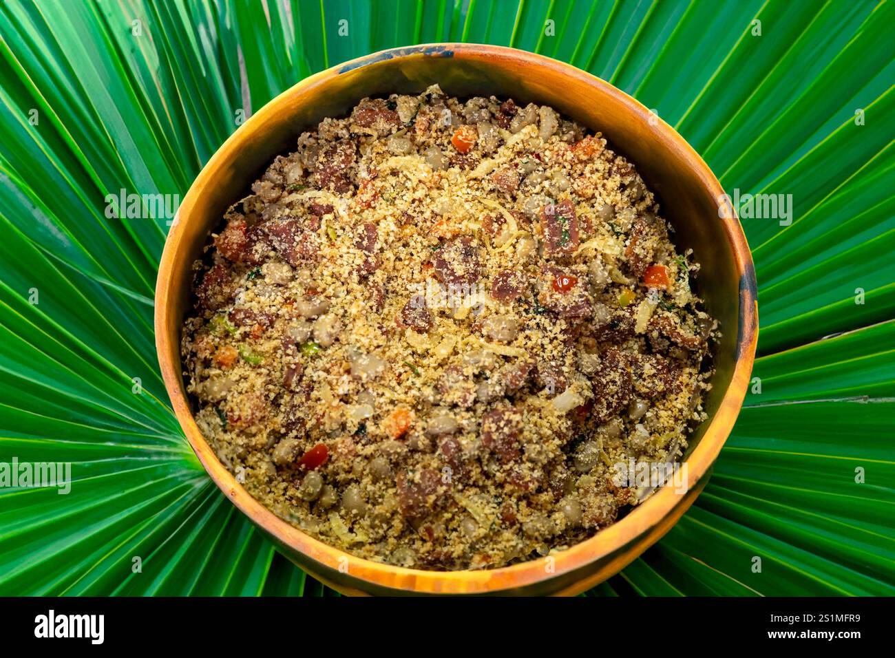 Traditional Brazilian farofa prepared with toasted cassava flour, bacon ...