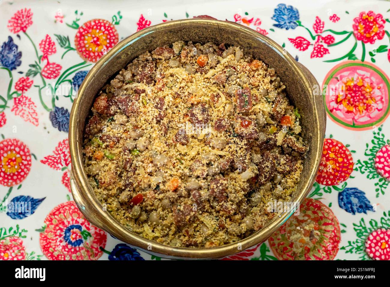 Traditional Brazilian farofa prepared with toasted cassava flour, bacon ...
