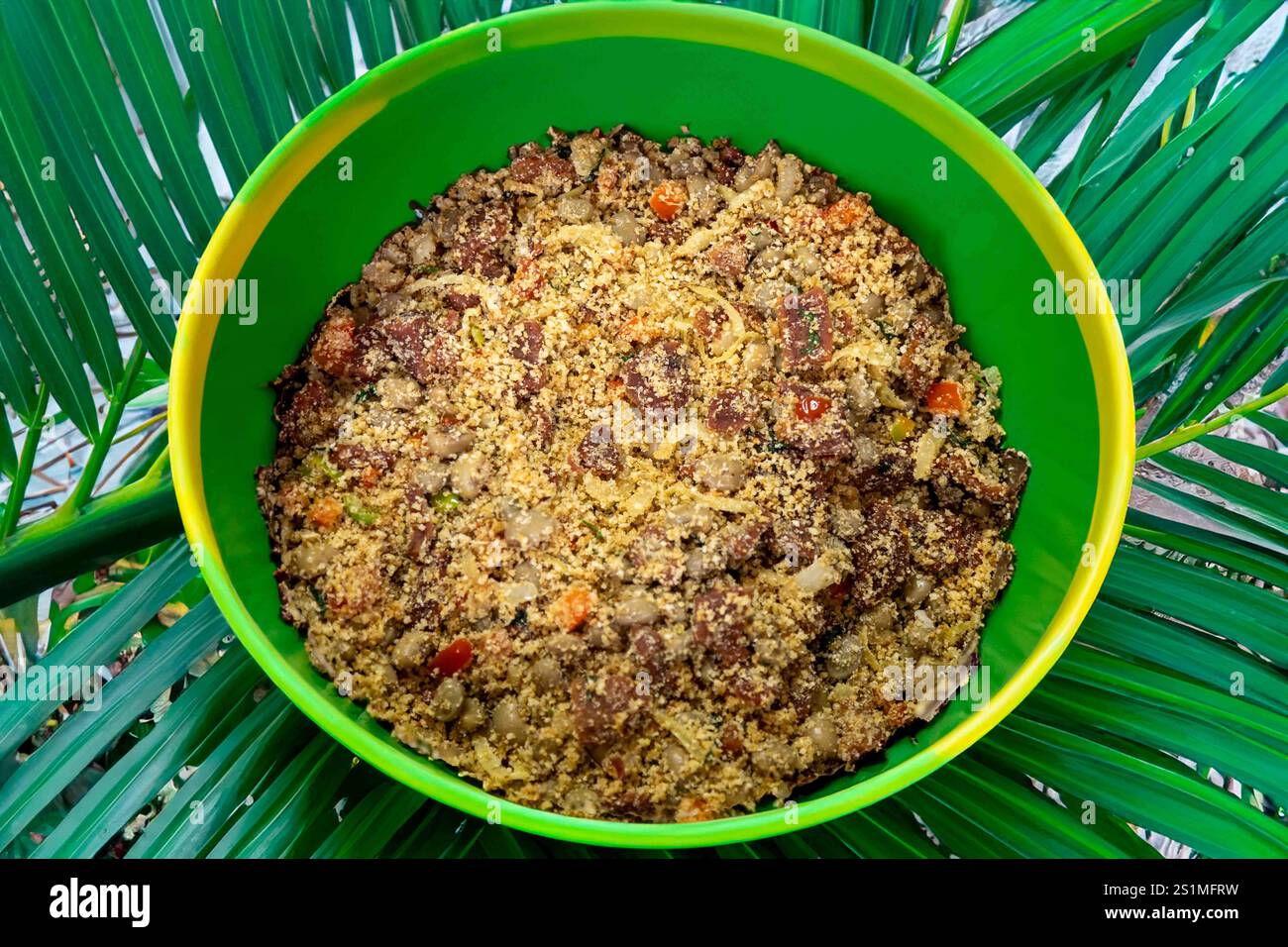 Traditional Brazilian farofa prepared with toasted cassava flour, bacon ...