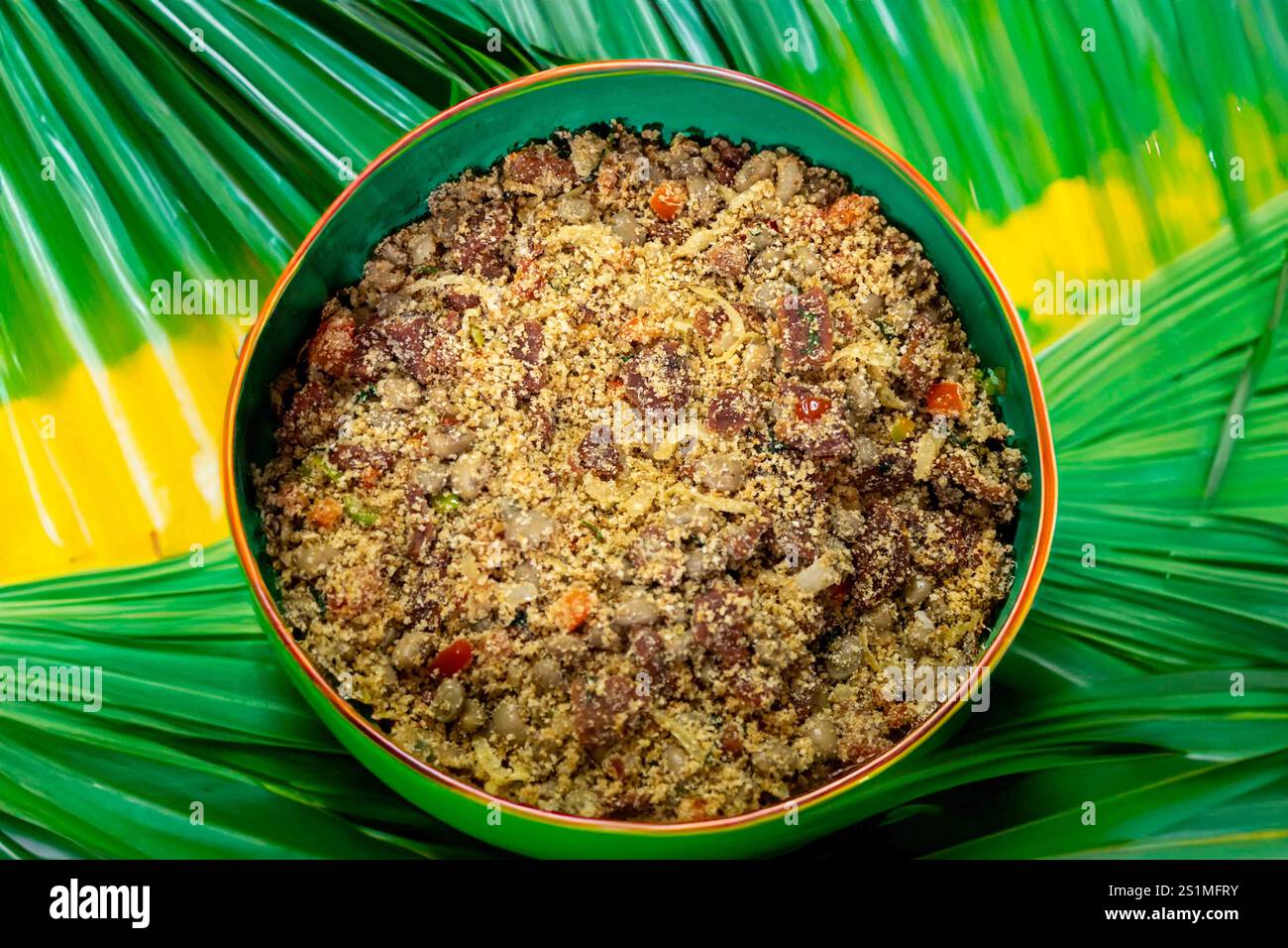 Traditional Brazilian farofa prepared with toasted cassava flour, bacon ...