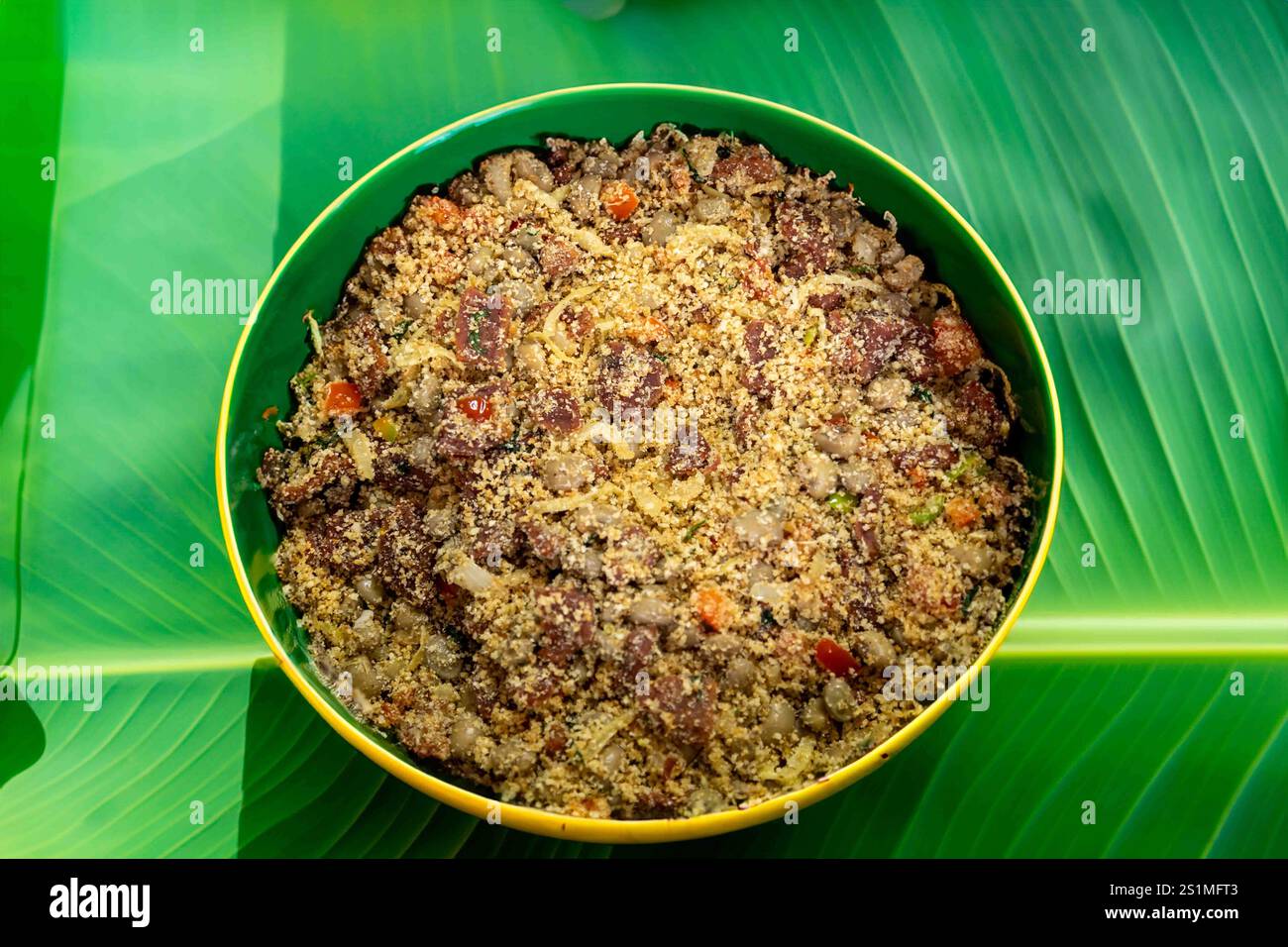 Traditional Brazilian farofa prepared with toasted cassava flour, bacon ...