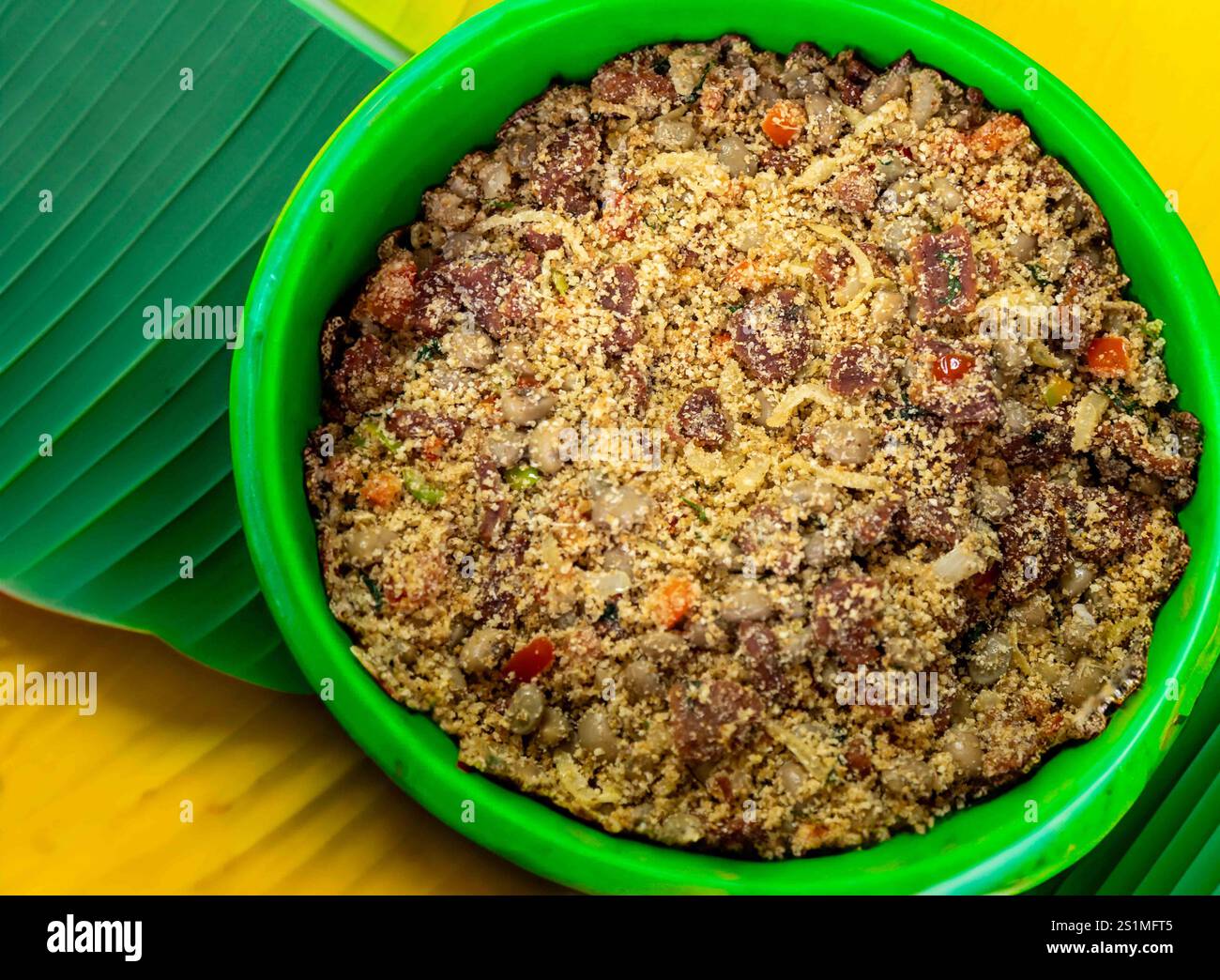 Traditional Brazilian farofa prepared with toasted cassava flour, bacon ...