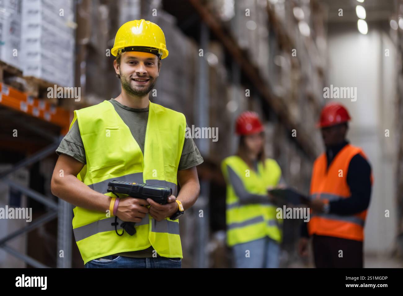 Warehouse employee wearing high visibility hi-res stock photography and ...