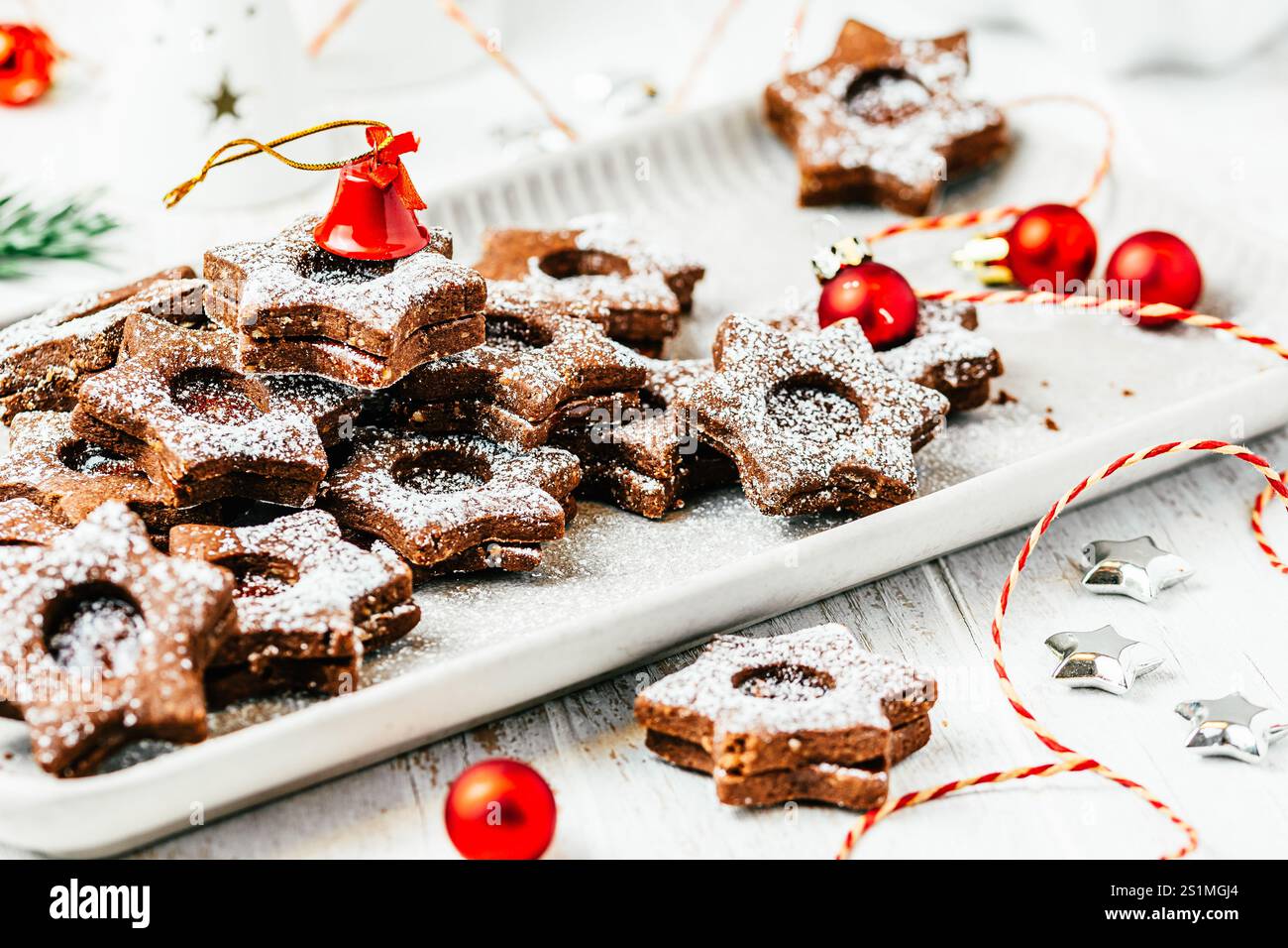 Traditional Linz Christmas cookies filled with quince jam on a white ...
