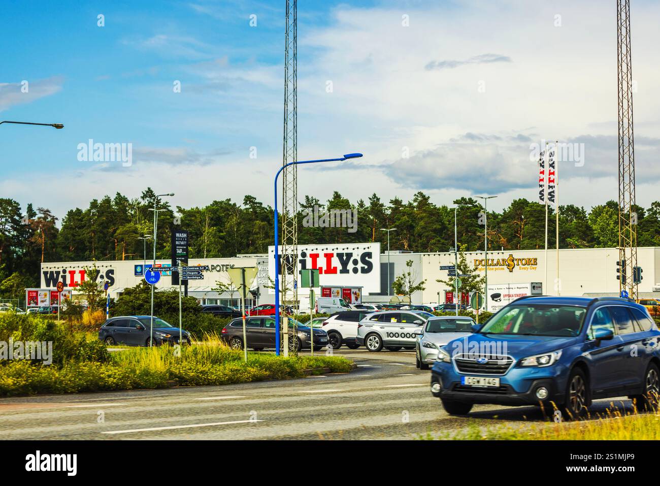 Exit road from shopping centers leading to highway with cars, traffic ...