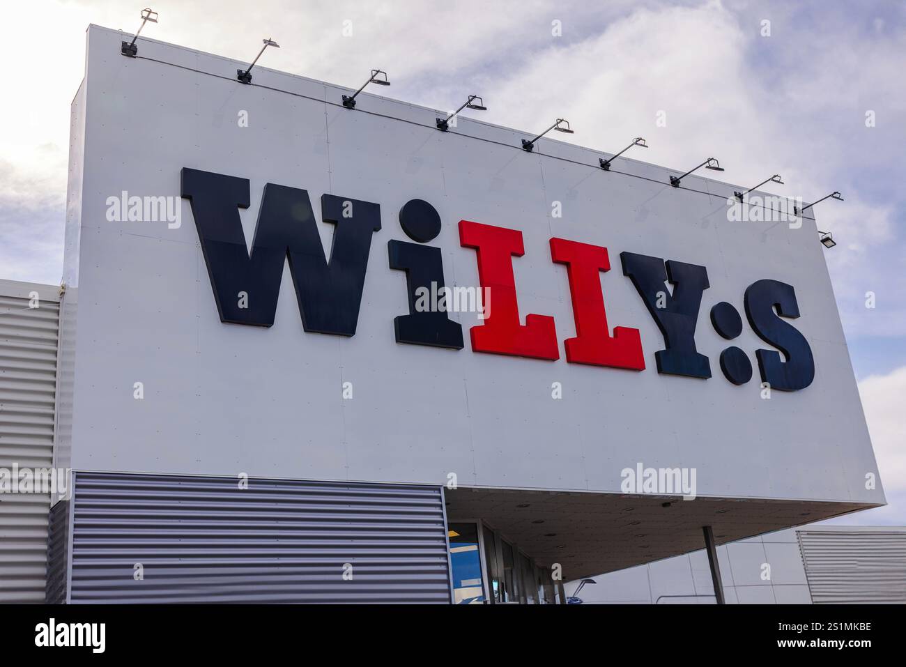 Large sign with bold letters spelling Willy:s on exterior facade of ...