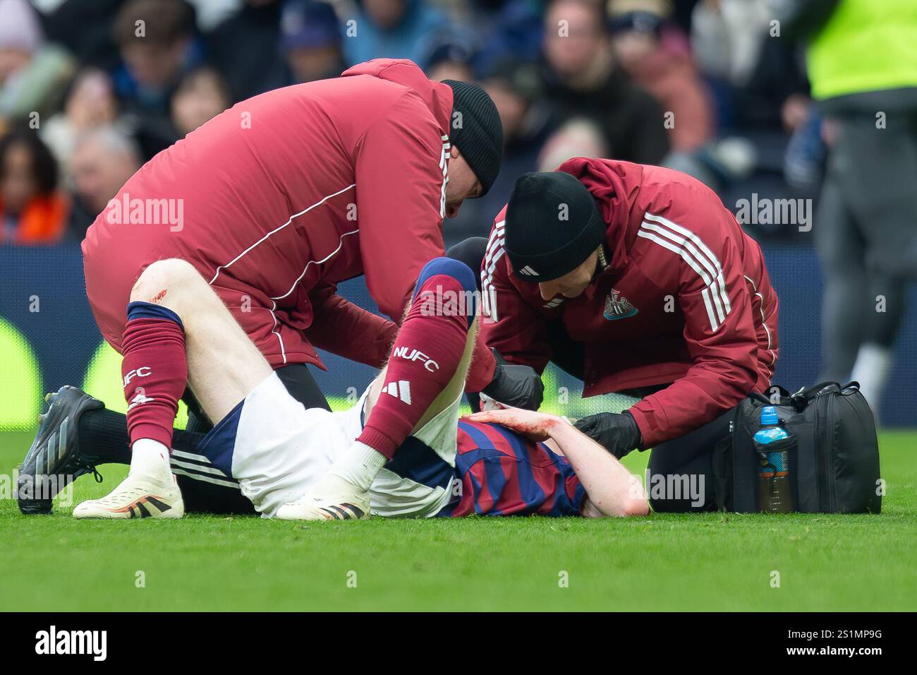 London, England, 4th January 2025. Newcastle medical staff attend to ...