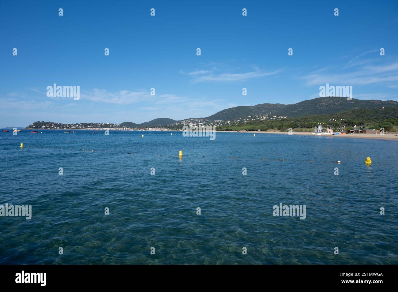 Morning view on crystal clear blue water and pier of Plage du ...