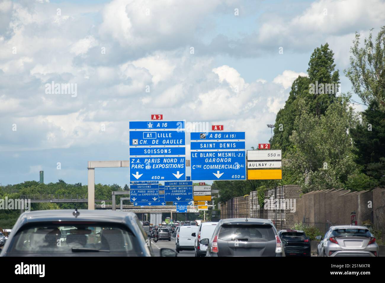 Toll road in France, road signs and directions, driving car in summer ...