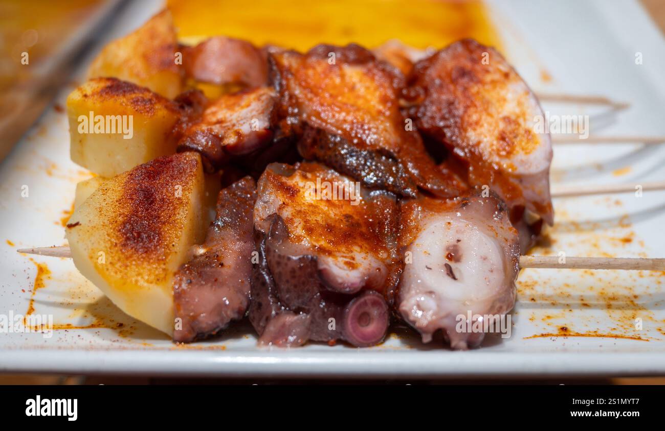 Typical snack of Basque Country, pinchos or pinxtos skewers with small ...
