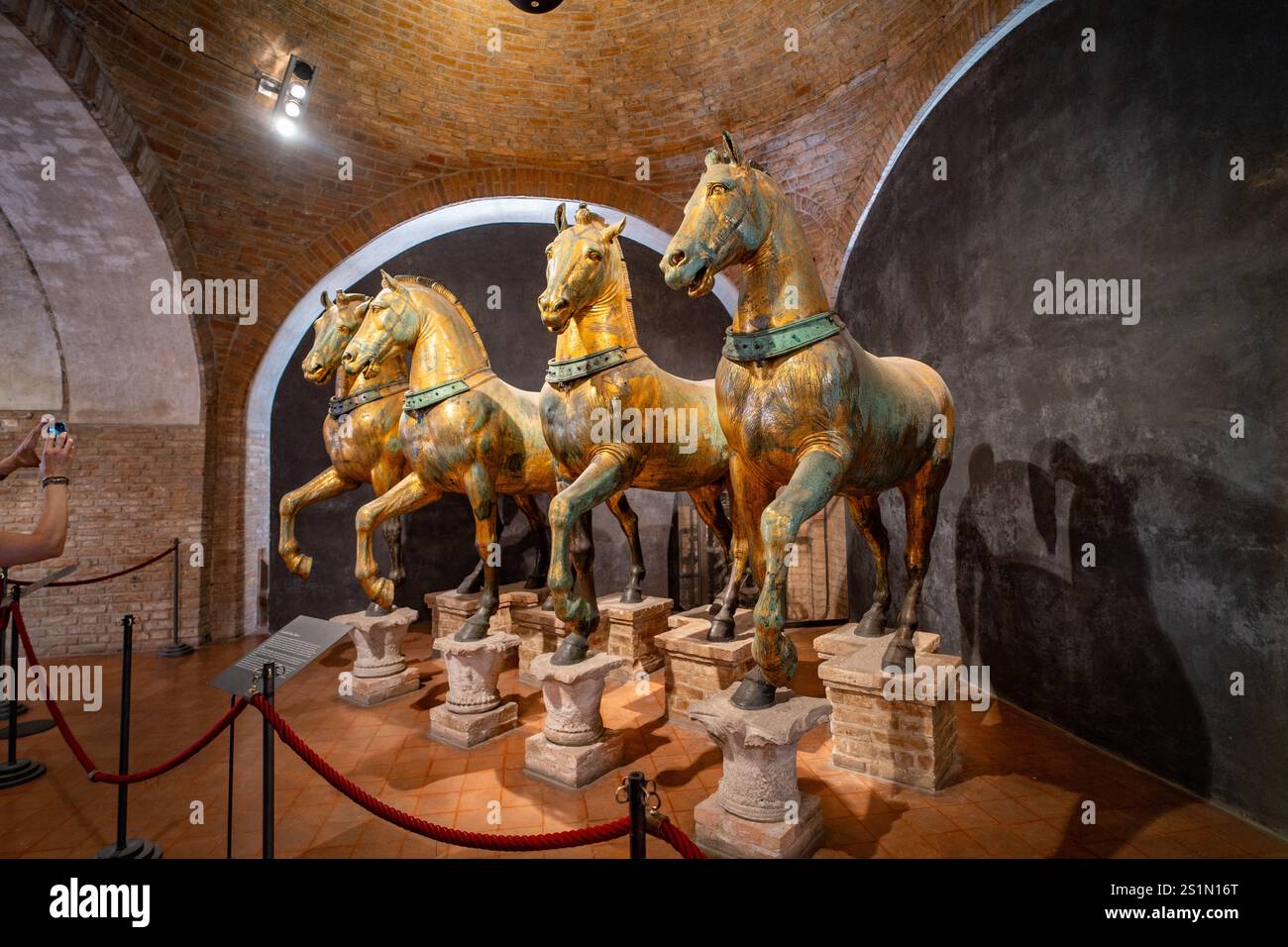 Ancient bronze horse statues displayed in a museum exhibit, showcasing ...