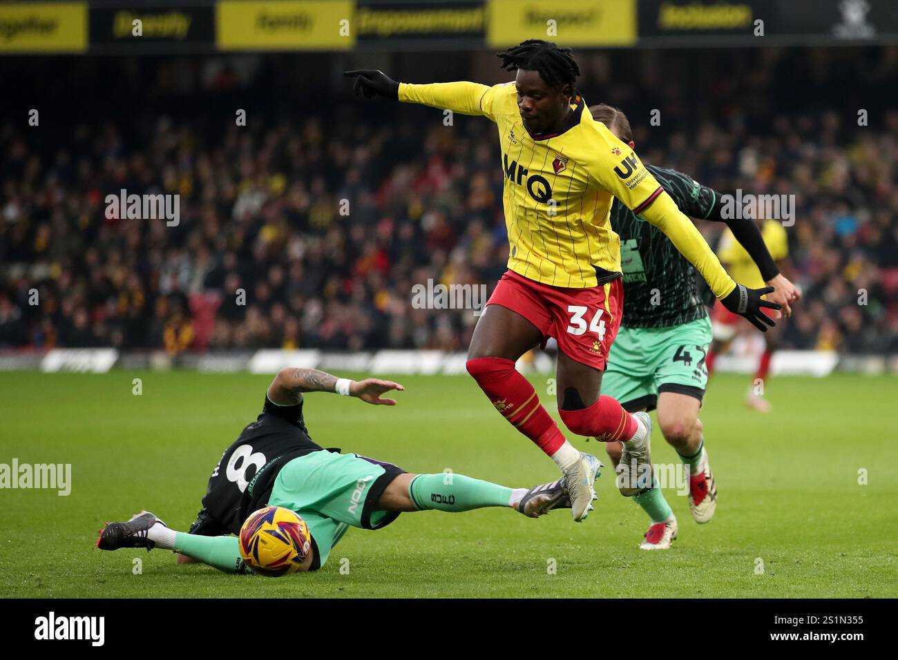 Watford's Kwadwo Baah battles for the ball against Sheffield United's ...