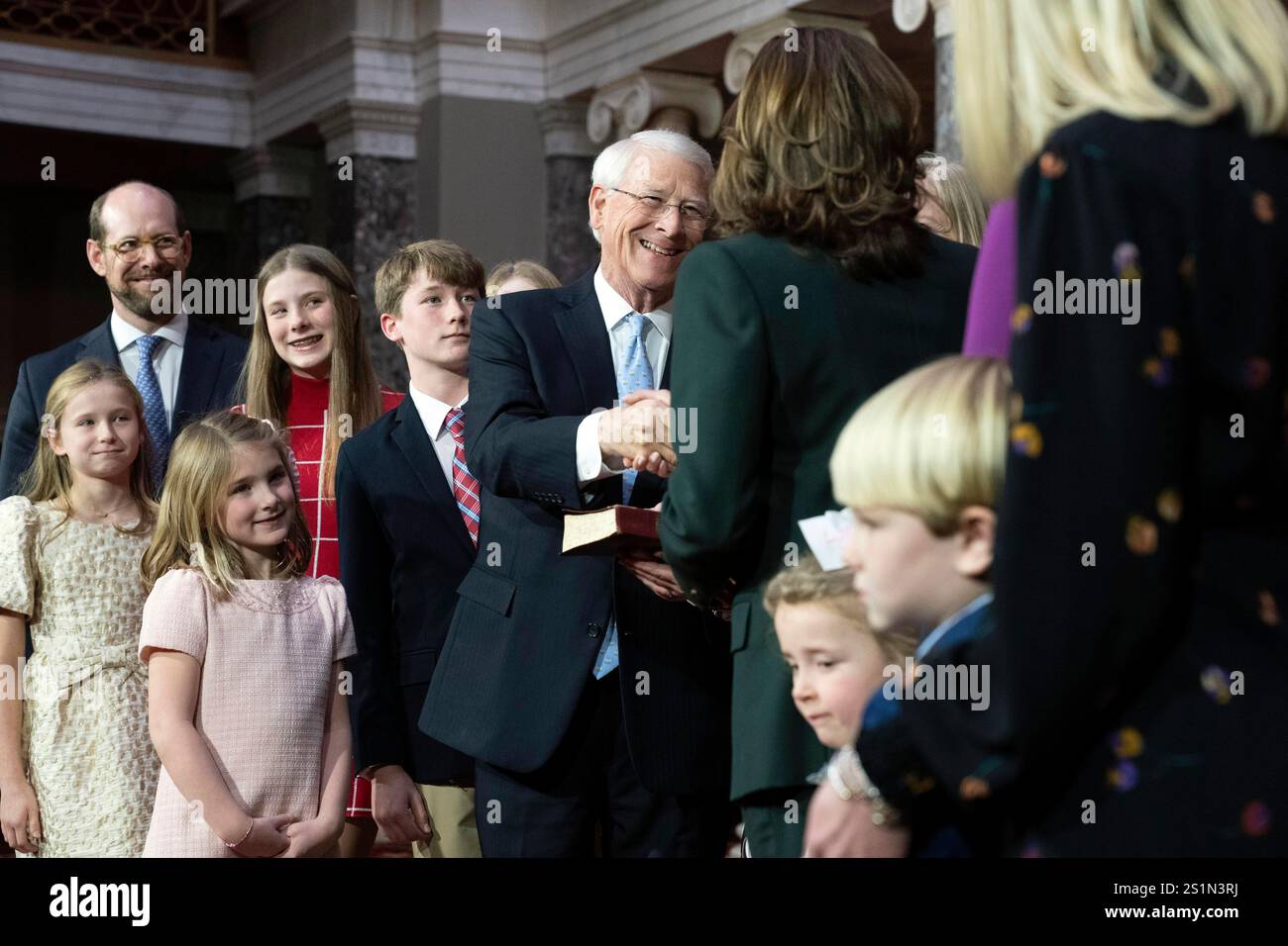 Vice President Kamala Harris, center right, holds a ceremonial swearing ...