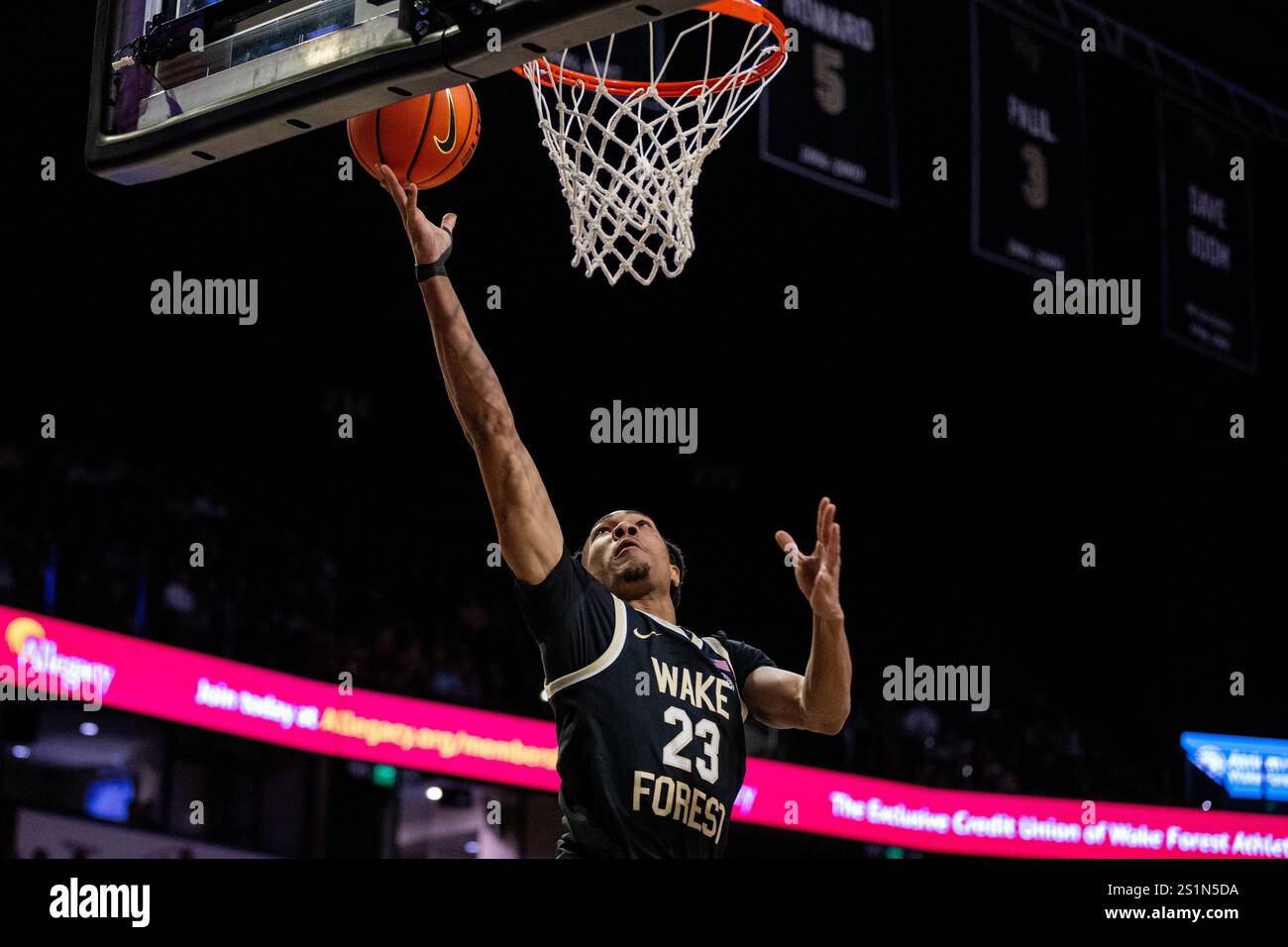Winston-Salem, NC, USA. 4th Jan, 2025. Wake Forest guard Hunter Sallis (23) shoots against the ...