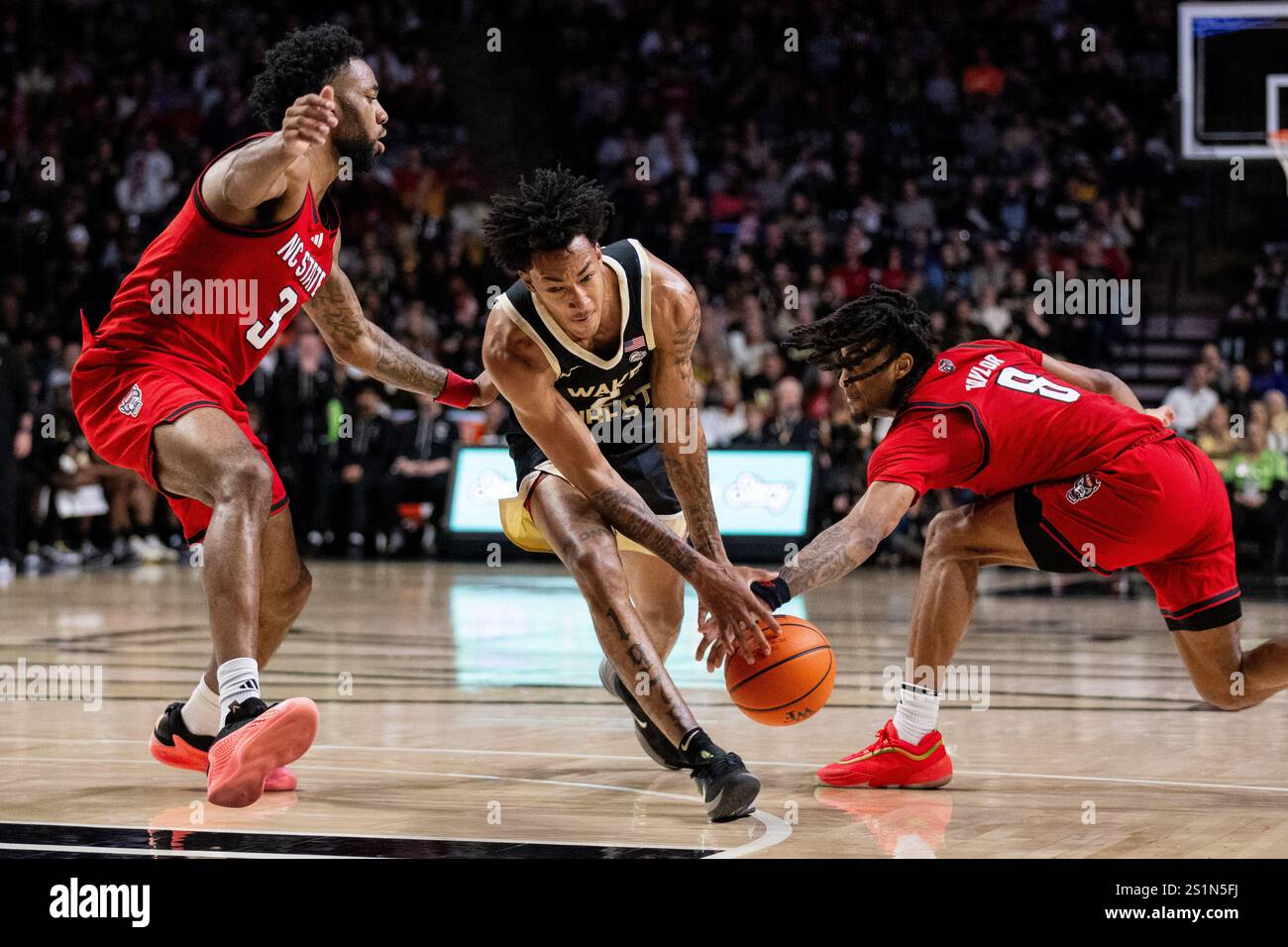 January 4, 2025: North Carolina State guard Jayden Taylor (8) knocks ...