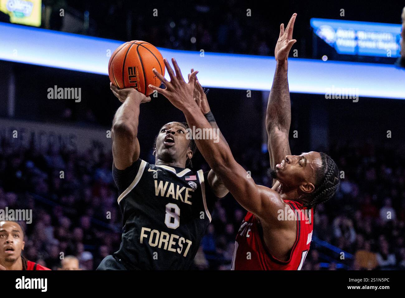 Winston-Salem, NC, USA. 4th Jan, 2025. Wake Forest guard Ty-Laur Johnson (8) shoots on North ...