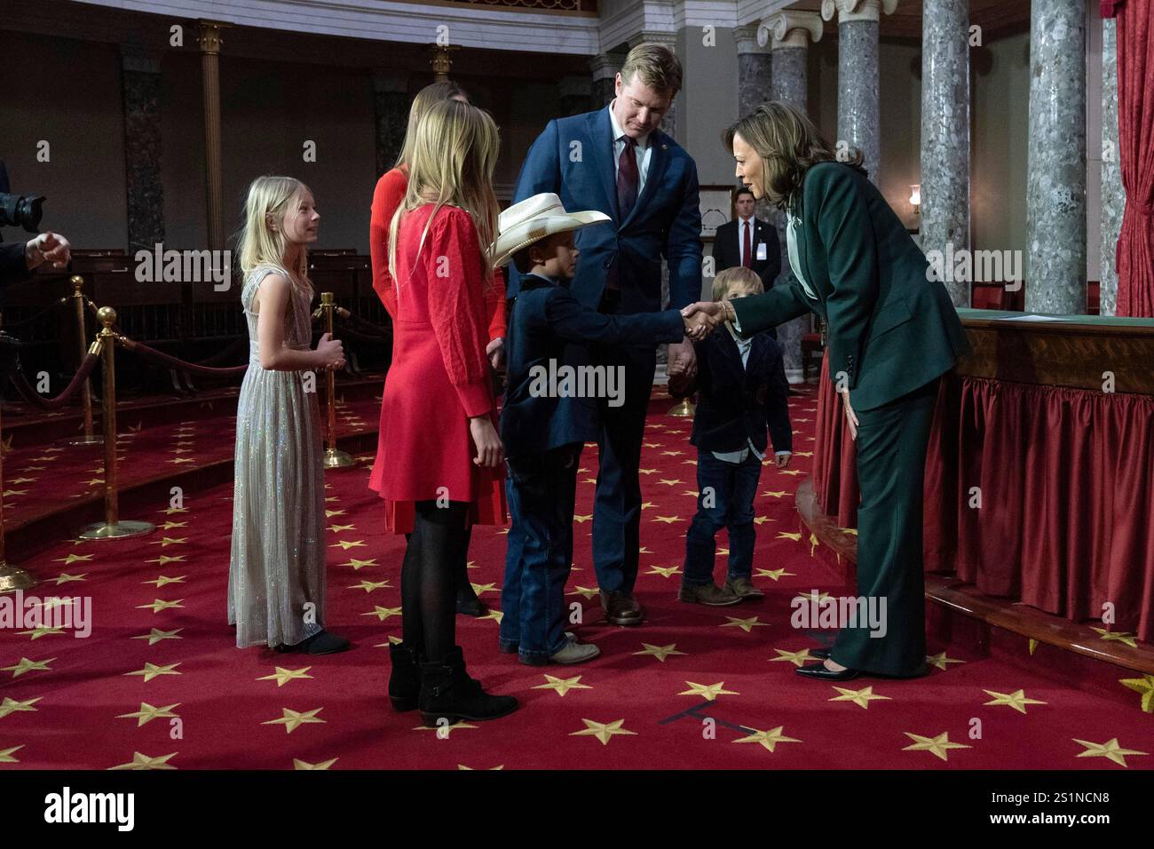 Vice President Kamala Harris, right, greets the family of Sen.Tim ...
