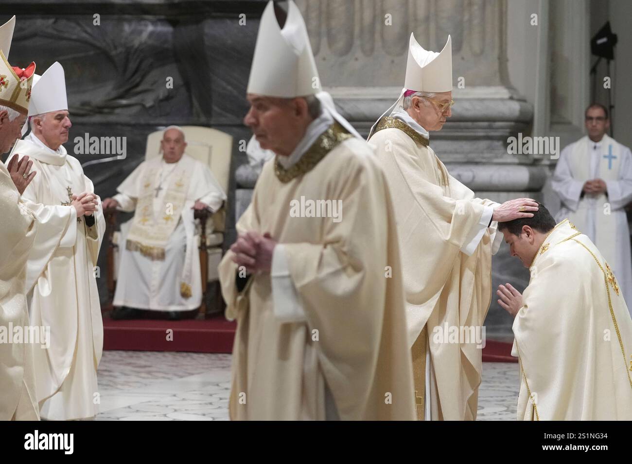 A bishop blesses the newly ordained bishop Renato Tarantelli Baccari ...