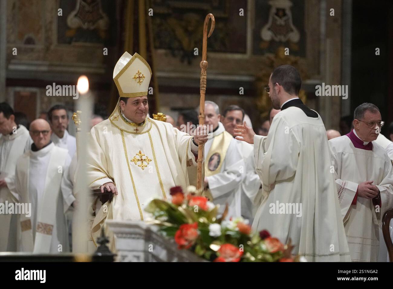Newly ordained bishop Renato Tarantelli Baccari holds his pastoral ...