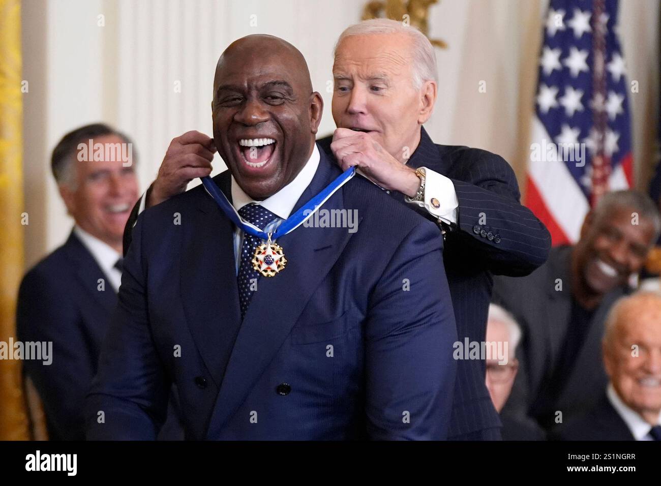 President Joe Biden, right, presents the Presidential Medal of Freedom ...