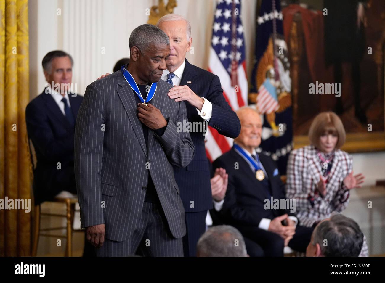 President Joe Biden, right, presents the Presidential Medal of Freedom ...