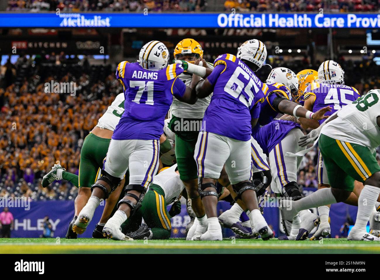 HOUSTON, TX - DECEMBER 31: LSU Tigers offensive lineman Tyree Adams (71) and LSU Tigers ...