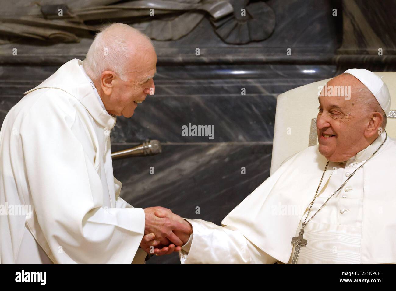 Rome, Italy, January 4, 2025. 0Pope Francis greets a priest as he ...