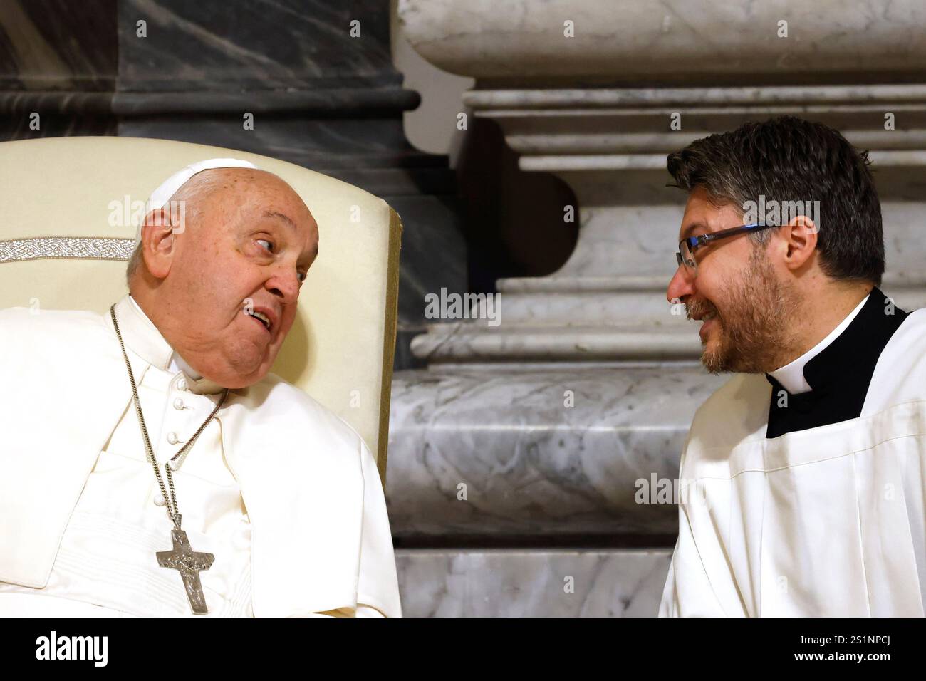 Rome, Italy, January 4, 2025. 0Pope Francis listens to a priest as he ...