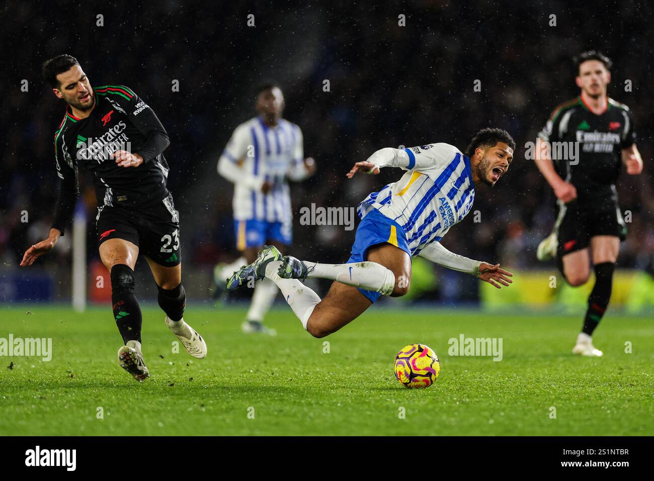 Brighton's Georgino Rutter is tackled by Arsenal's Mikel Merino, left ...