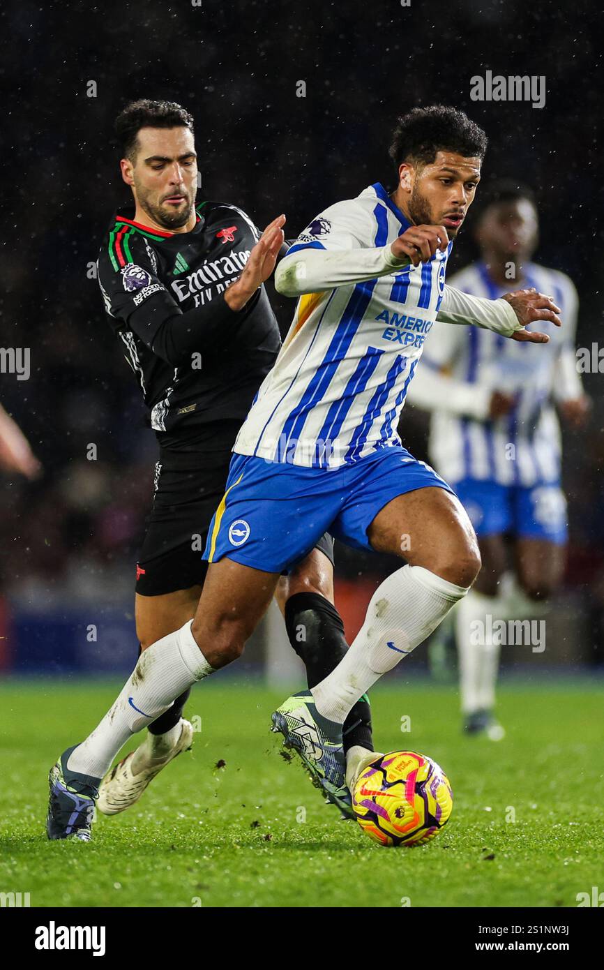 Brighton's Georgino Rutter is tackled by Arsenal's Mikel Merino, left ...
