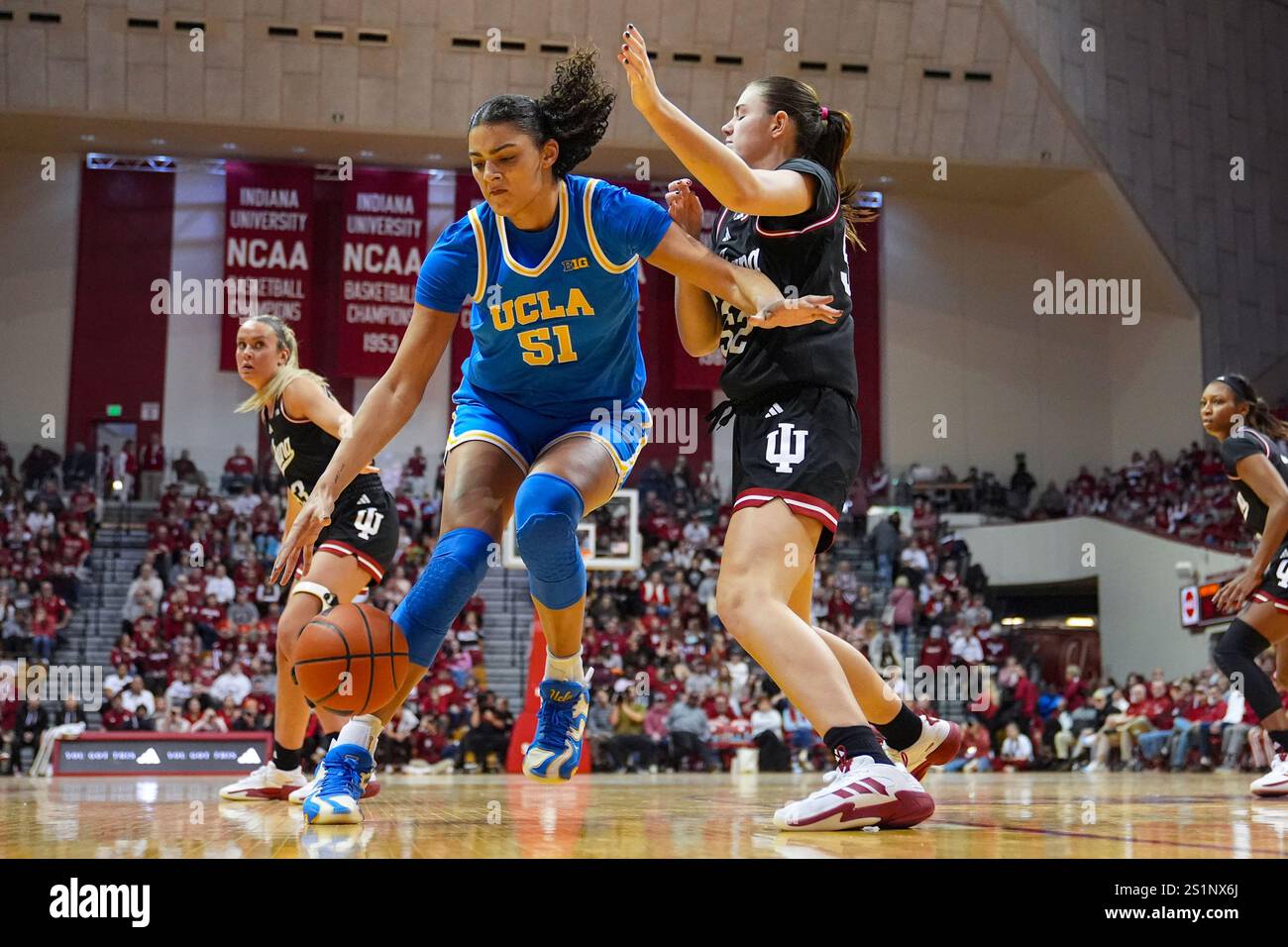 UCLA center Lauren Betts (51) drives on Indiana forward Lilly Meister ...