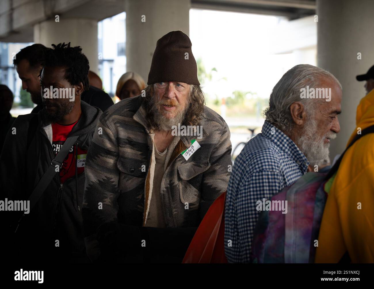 Tampa, Florida, USA. 28th Dec, 2024. A homeless man waits for a hot ...