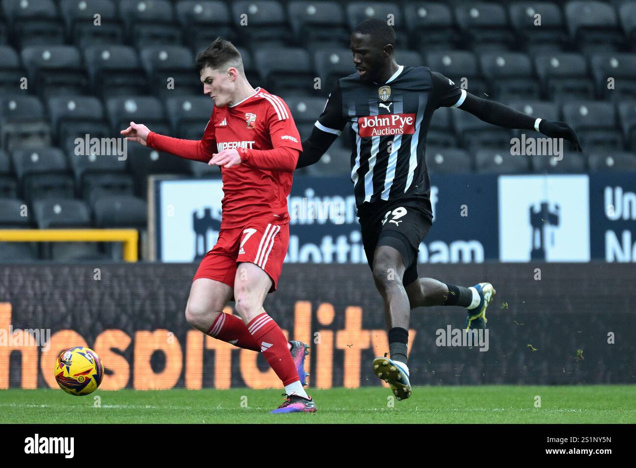 Joel Cotterill of Swindon Town under pressure from Alassana Jatta of Notts County during the Sky ...