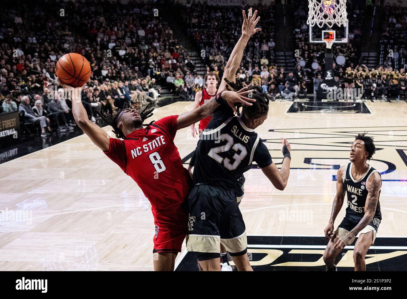 Winston-Salem, NC, USA. 4th Jan, 2025. North Carolina State guard ...