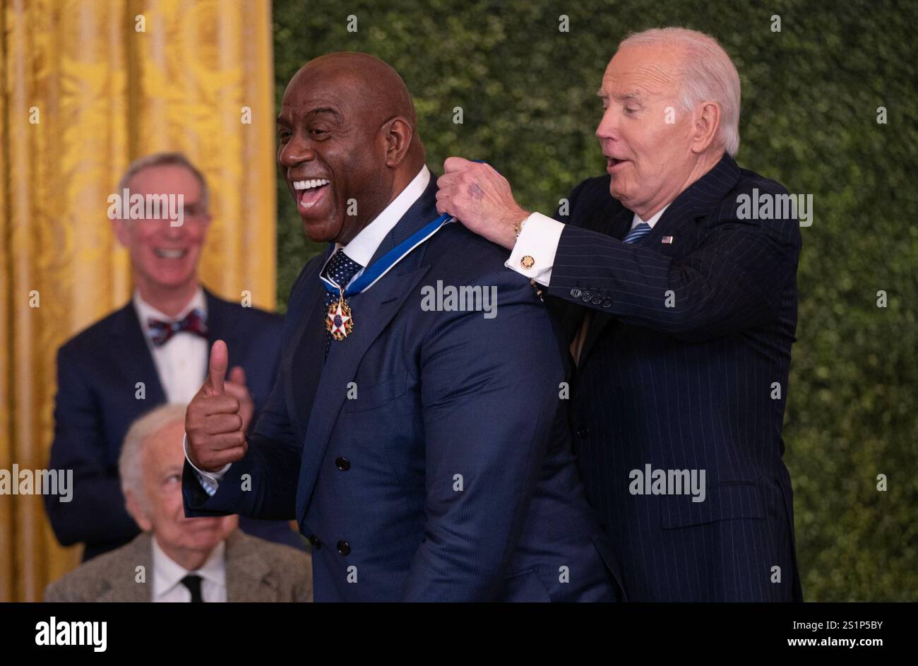 President Joe Biden presents retired athlete, philanthropist, and ...